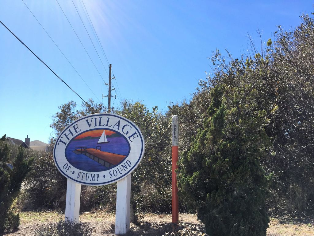 The Village of Stump Sound - Entrance Sign - The Cameron Team